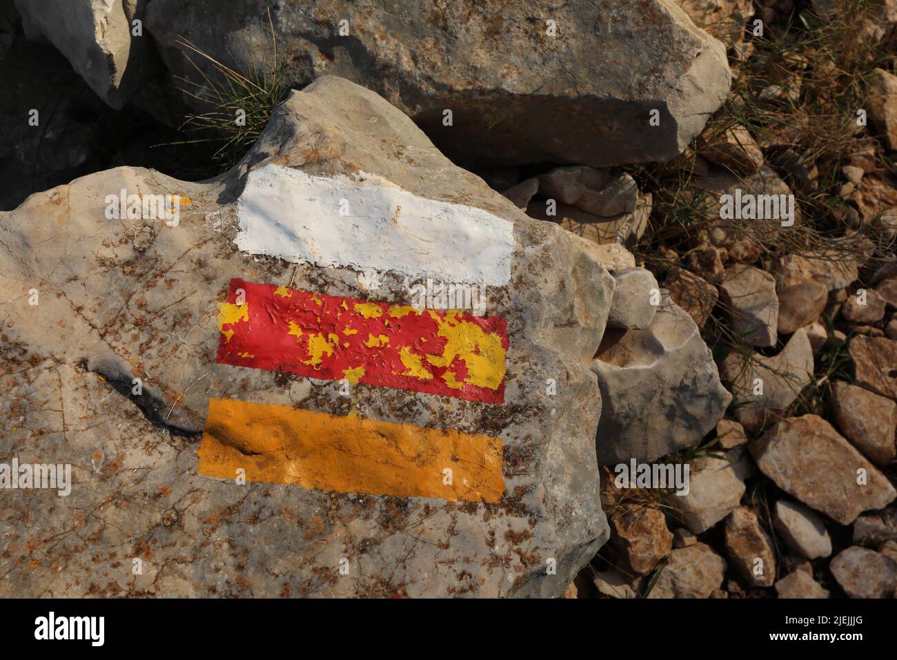 White Orange and Red painted lines on big rocks in the nature Stock ...