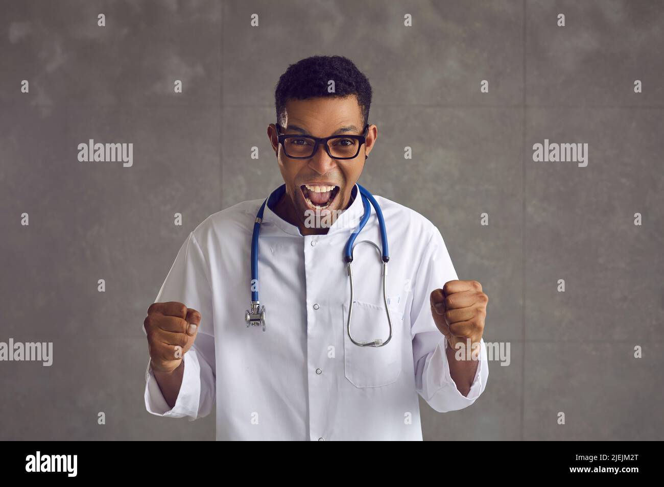 Cheering with clenched fists hi-res stock photography and images - Alamy