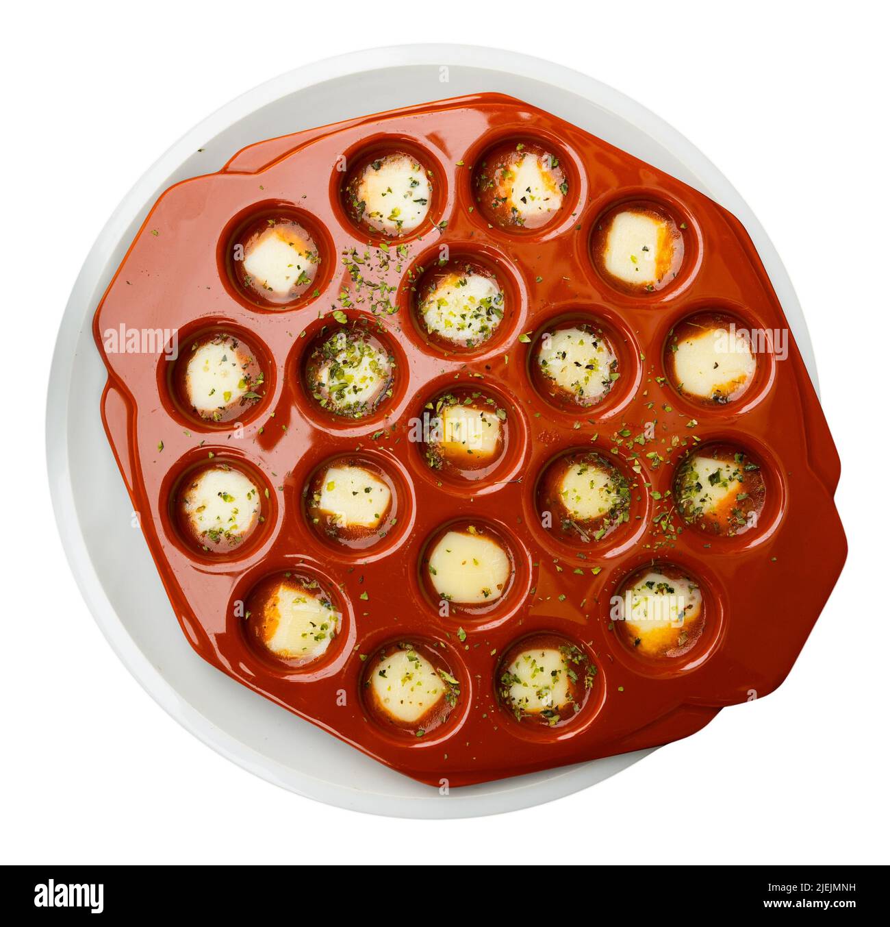 Spicy oven-baked Provolone cheese in ceramic baking dish Stock Photo ...