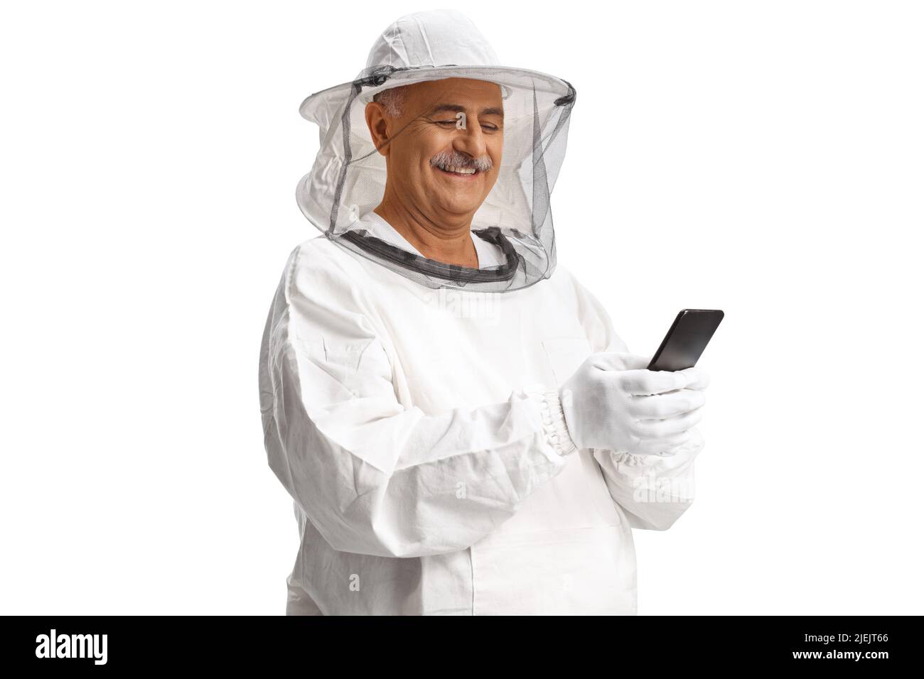 Mature male bee keeper in a uniform using a smartphone isolated on ...