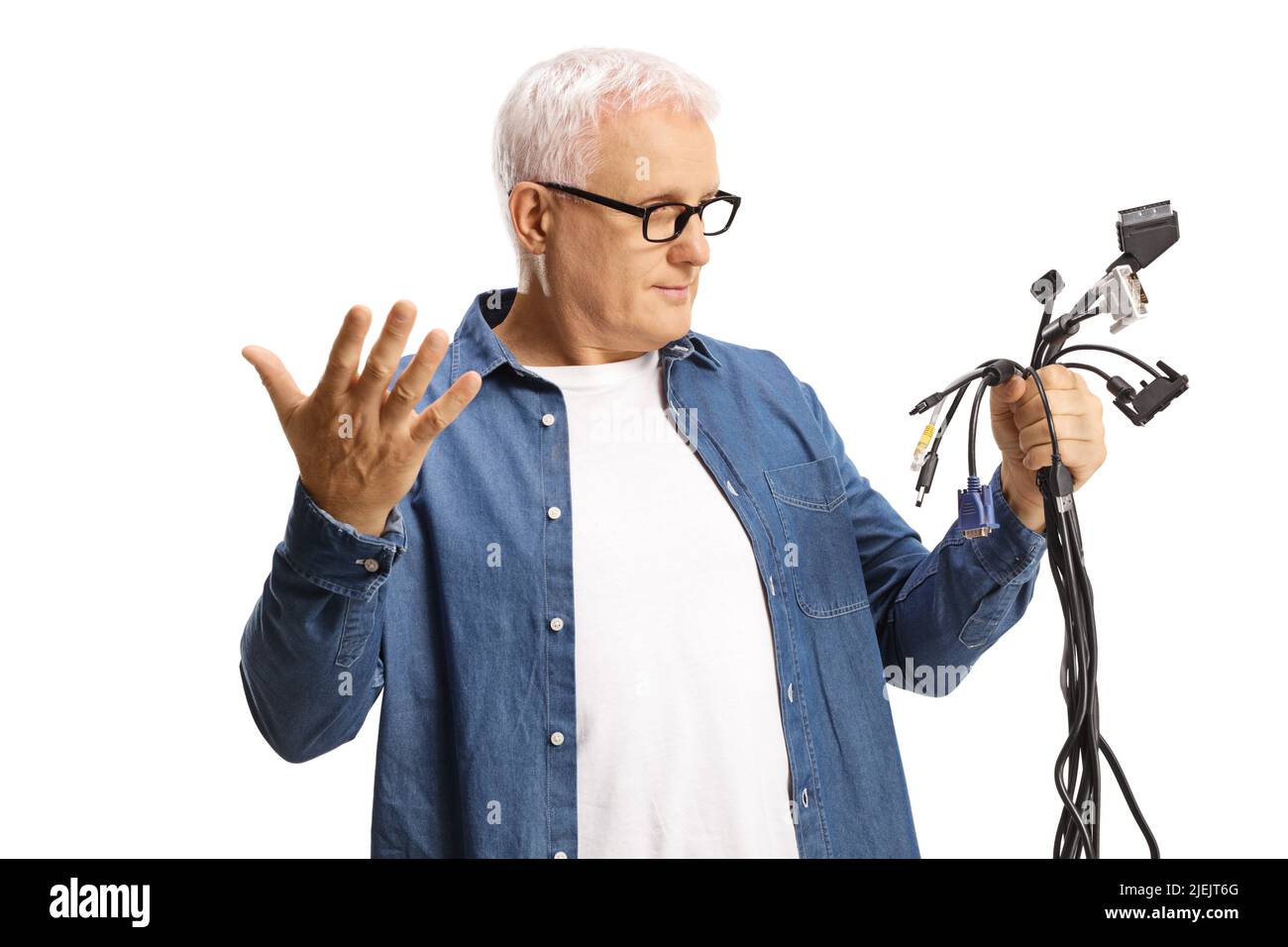 Mature man holding many cables and wondering what to do isolated on ...
