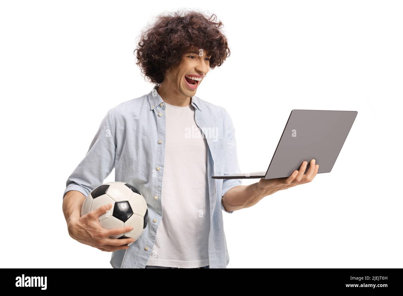 Happy excited guy holding a laptop computer and a football isolated on ...