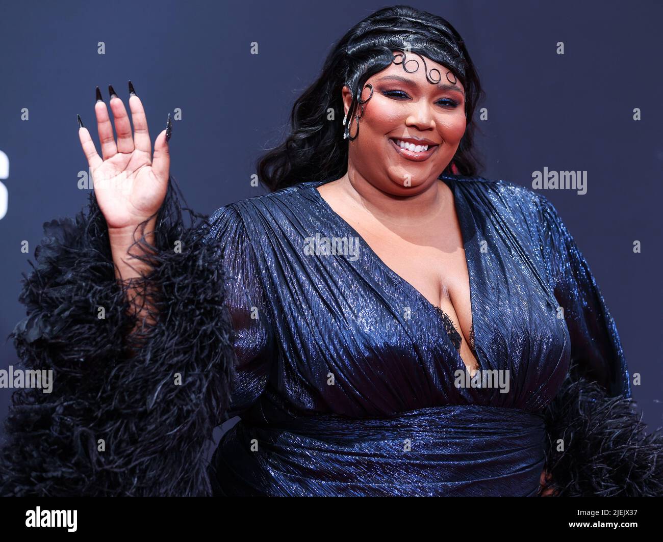 LOS ANGELES, CALIFORNIA, USA - JUNE 26: American singer Lizzo wearing a ...