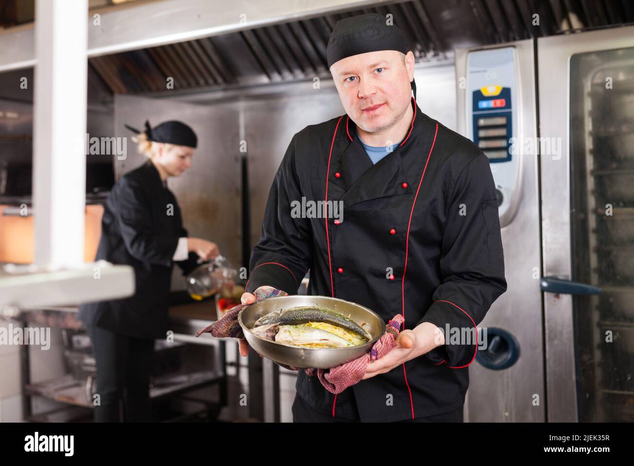 Man offering fish hi-res stock photography and images - Alamy
