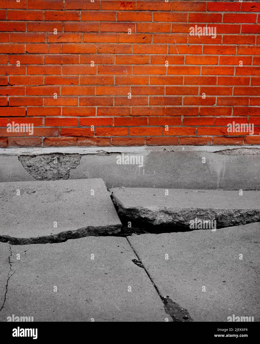 Broken sidewalk concrete crack dangerous cracked Stock Photo - Alamy