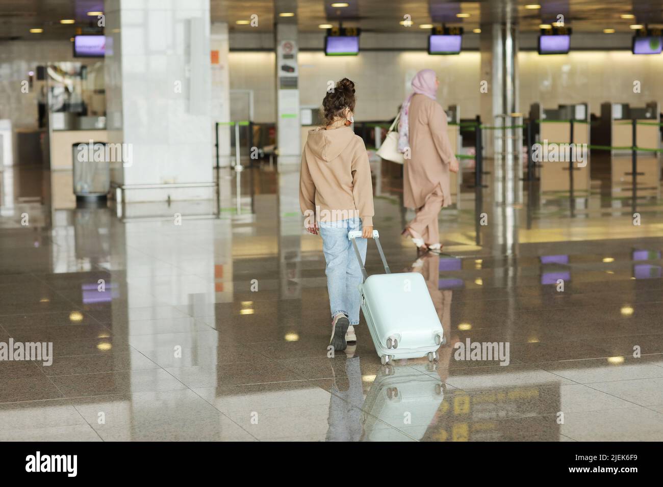 Traveling with children. cute teenage girl walking together with travel ...