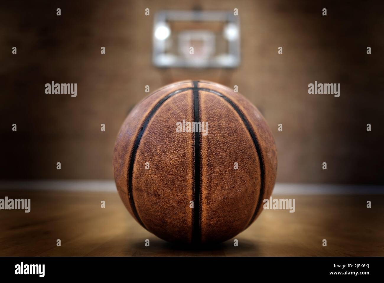 Basketball court with ball hoops rims hardwood floor and lights for ...