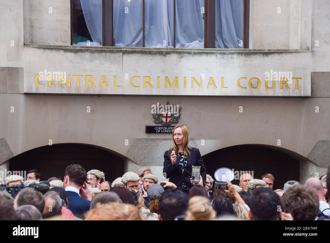 London, UK. 27th June, 2022. A barrister speaks outside the court ...