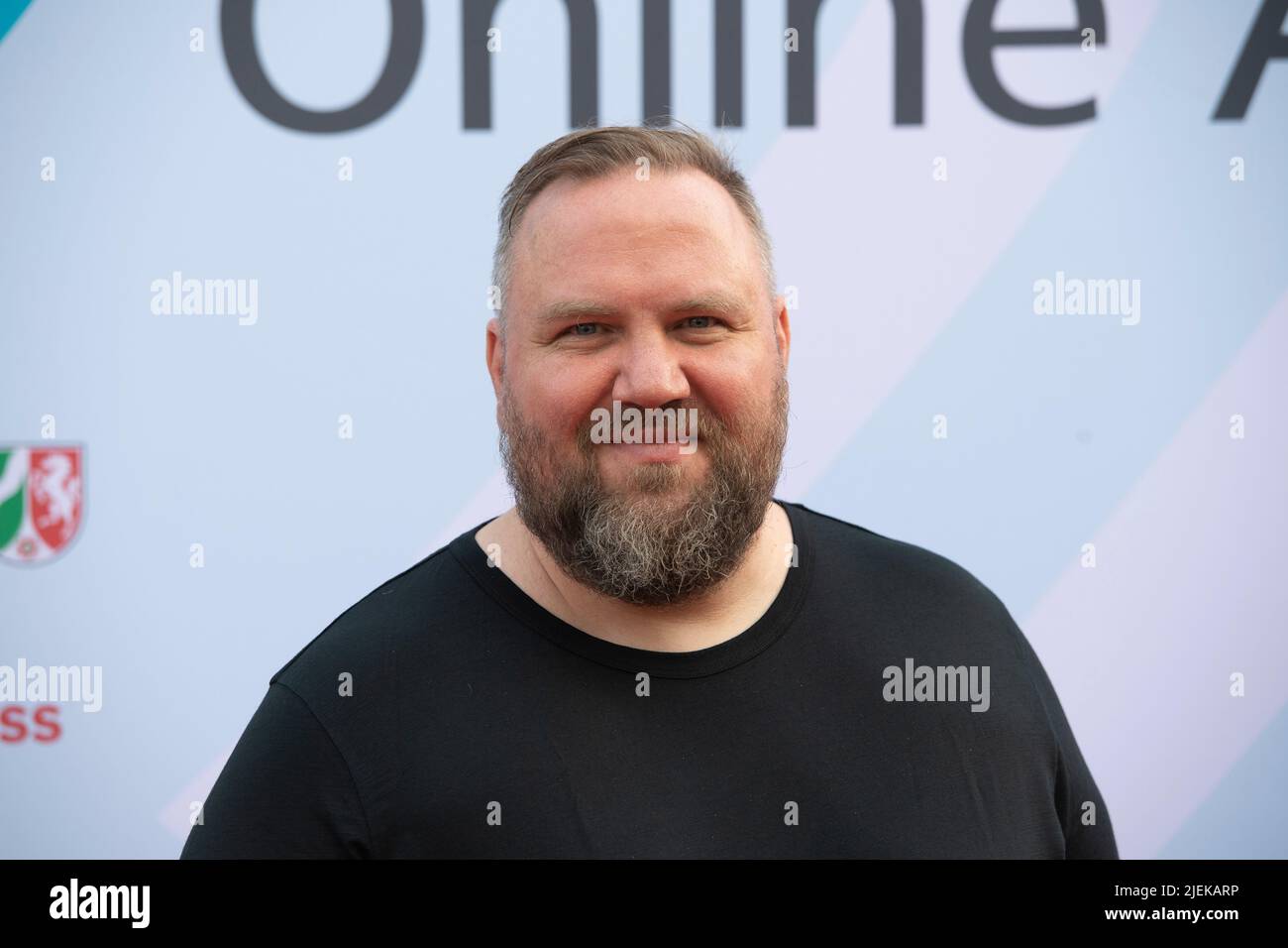 Cologne, Deutschland. 23rd June, 2022. Oliver HINZ, journalist, red ...