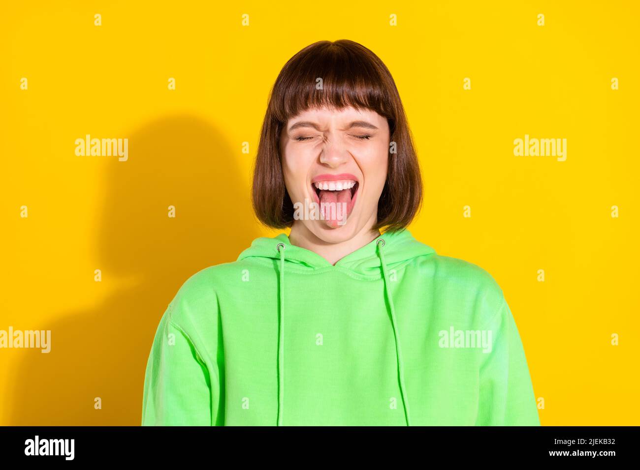 Portrait of attractive cheerful crazy girl wearing sport hood having ...