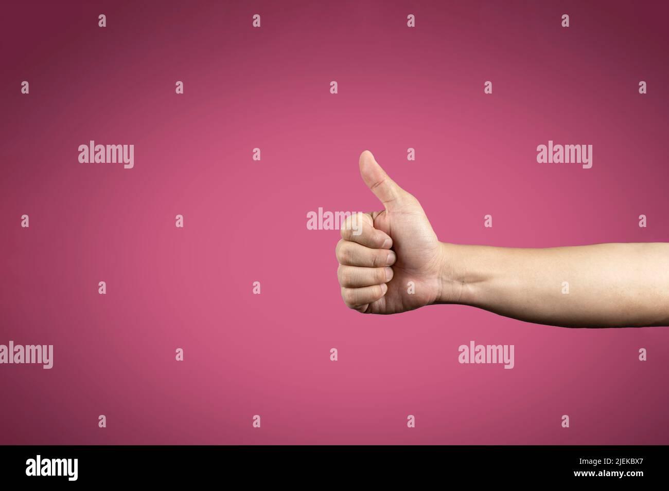 Thumb up symbol on vignetting dark pink background for banner ...