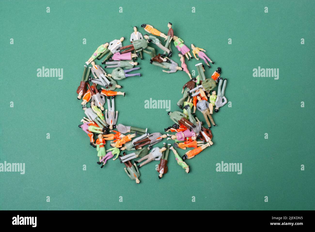 Colorful diverse miniature people figurines make crowd on ground Stock ...