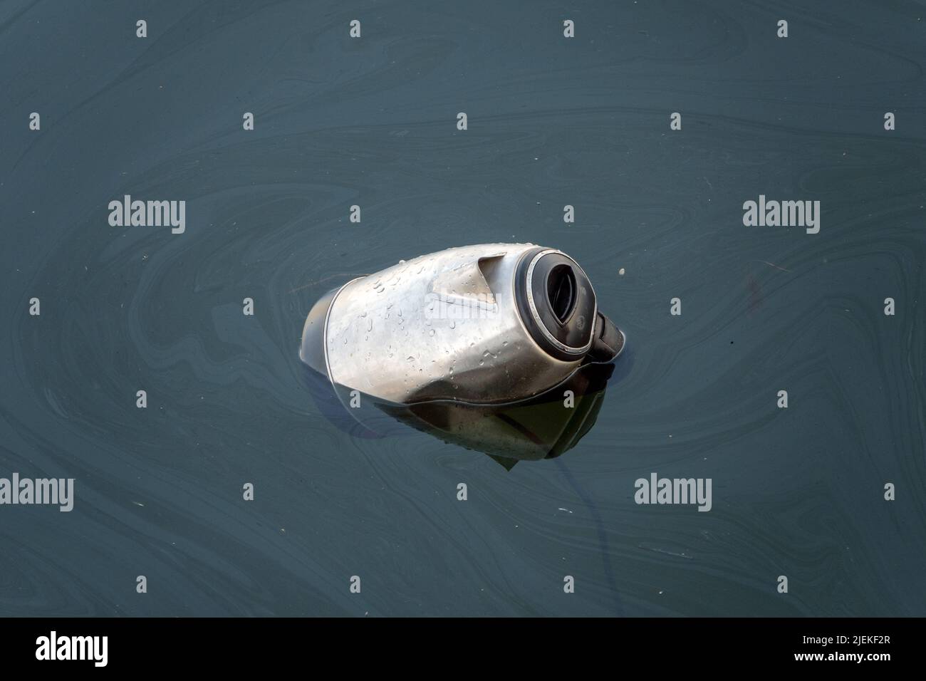 An electric kettle dumped and floating on the river Nile, Egypt Stock ...