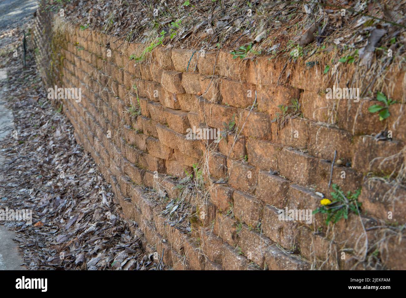 Rustic retaining wall in the mountains made of bricks and dirt Stock ...