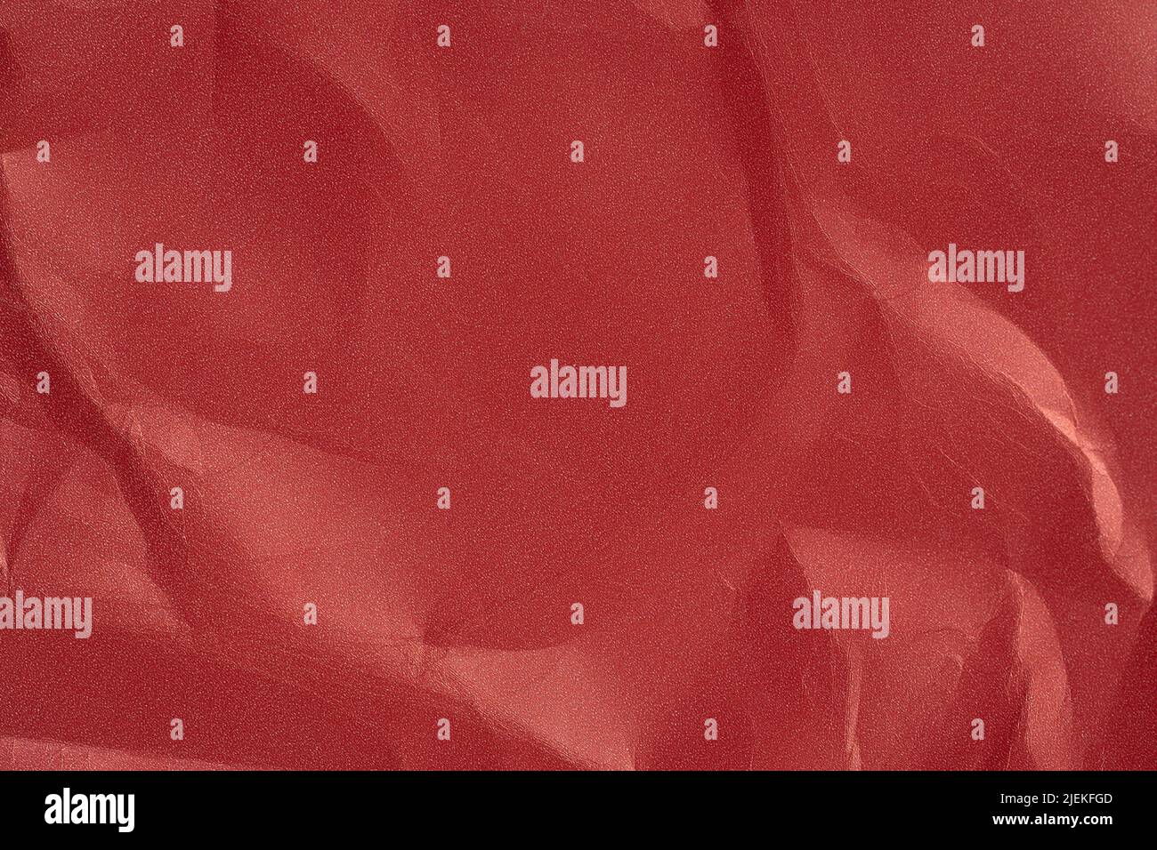 an empty wrinkled red pearl tissue paper textured background. text ...