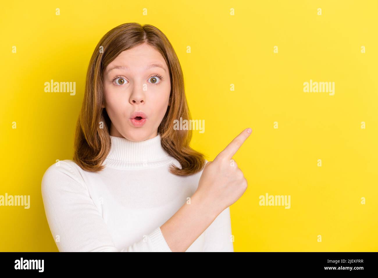 Photo of young girl amazed shocked surprised point finger empty space ...