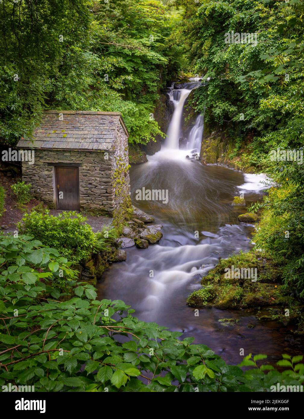 A river flowing over Rydal Falls in the Lake District National Park ...