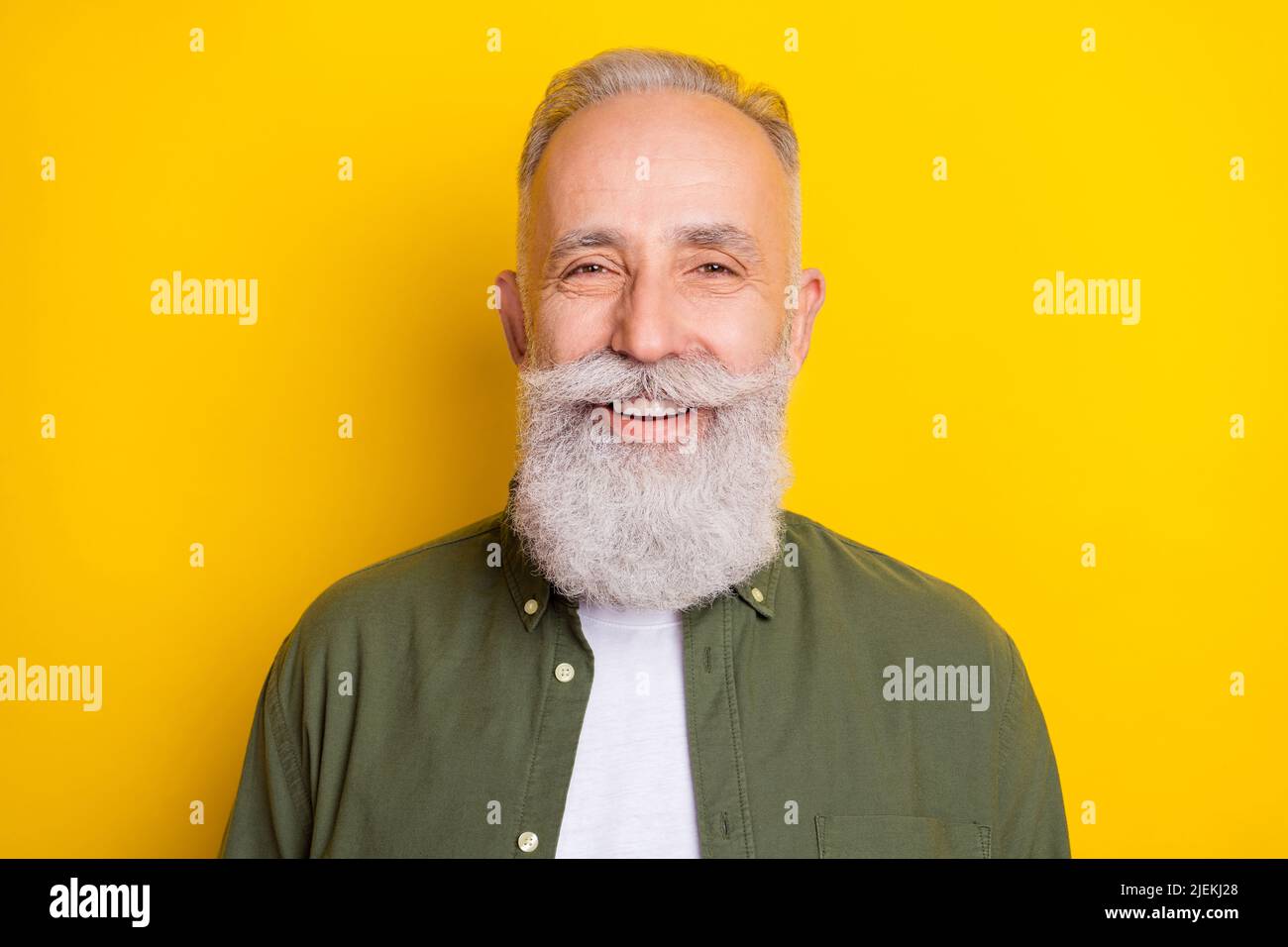Photo portrait of senior man smiling happy isolated on bright yellow ...