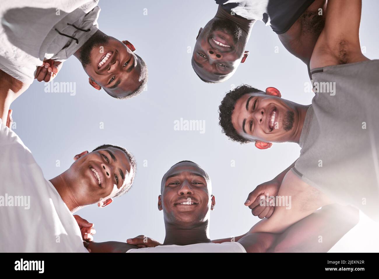 People huddle together in below hi-res stock photography and images - Alamy