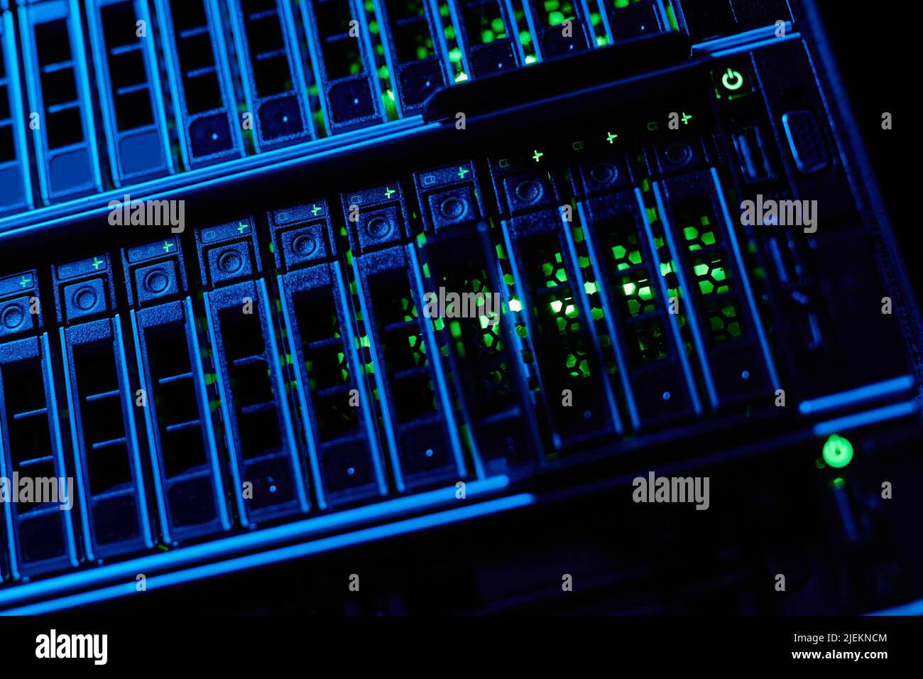 Close up background image of blade servers in blue neon light stacked ...