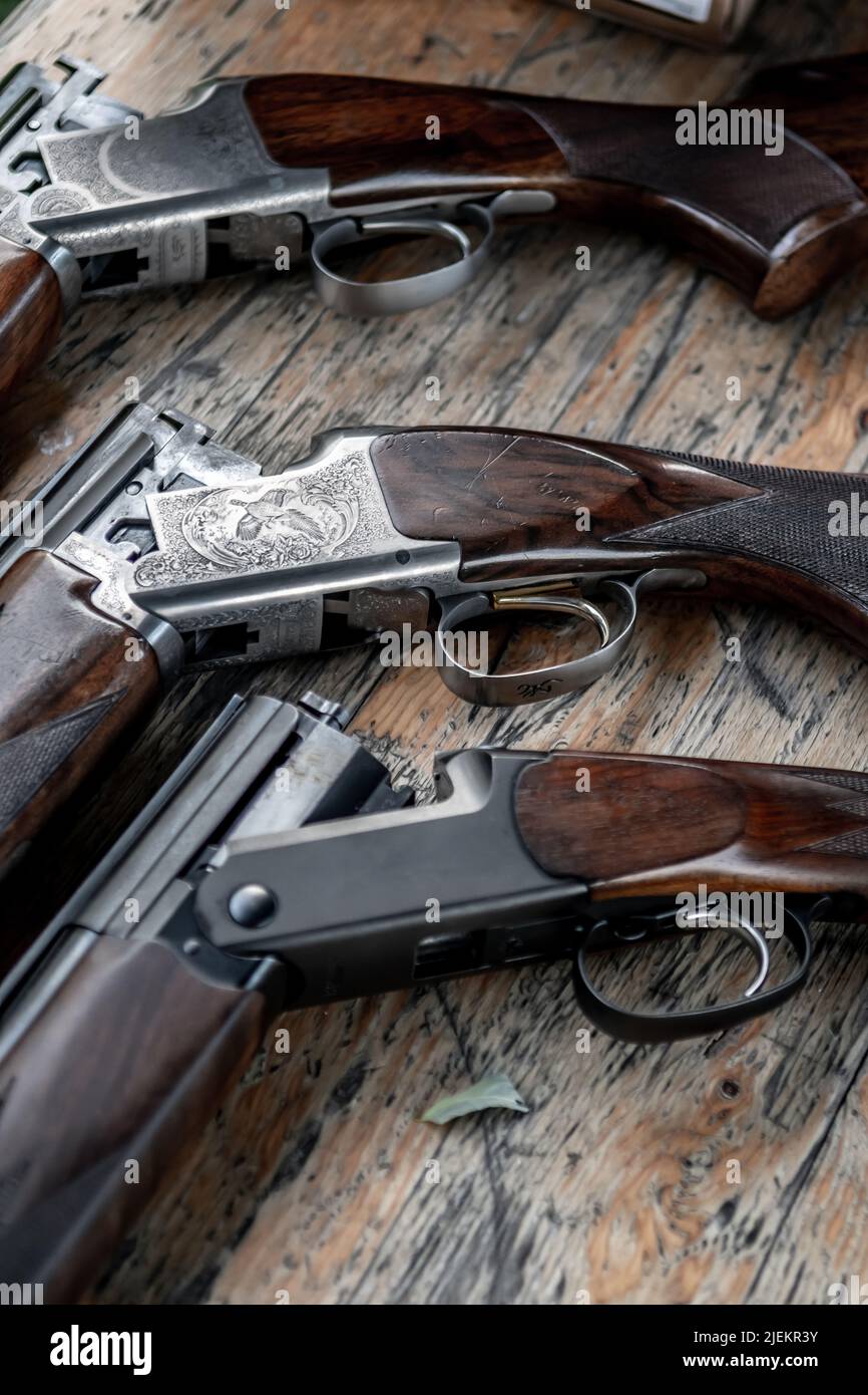 Detail Of Open Hunting Rifles Laying On Table Stock Photo - Alamy