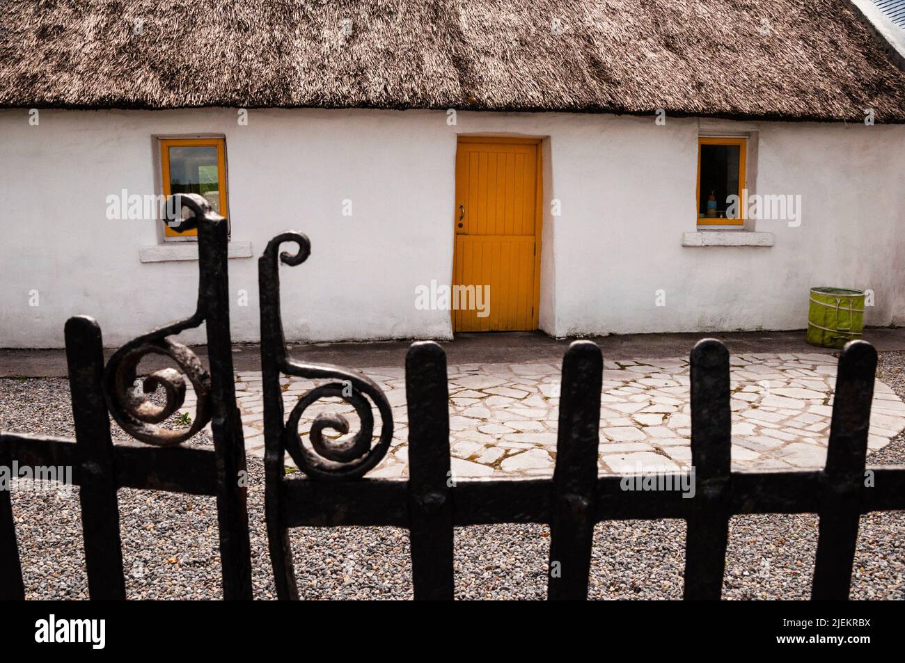 Iron gate and thatched roof cottage in Kinvara, Ireland Stock Photo - Alamy