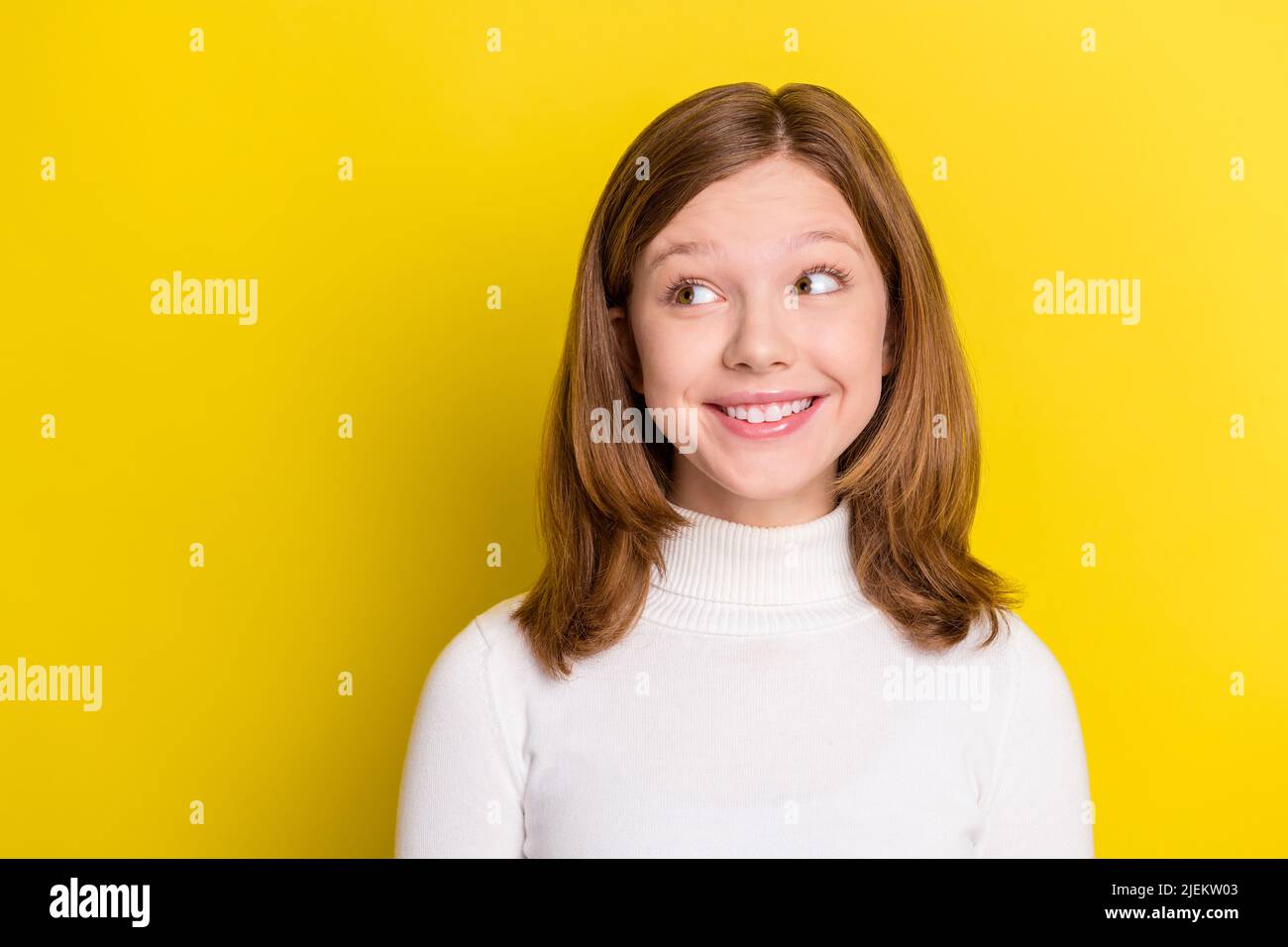Photo of dreamy young curious little girl look empty space imagine ...