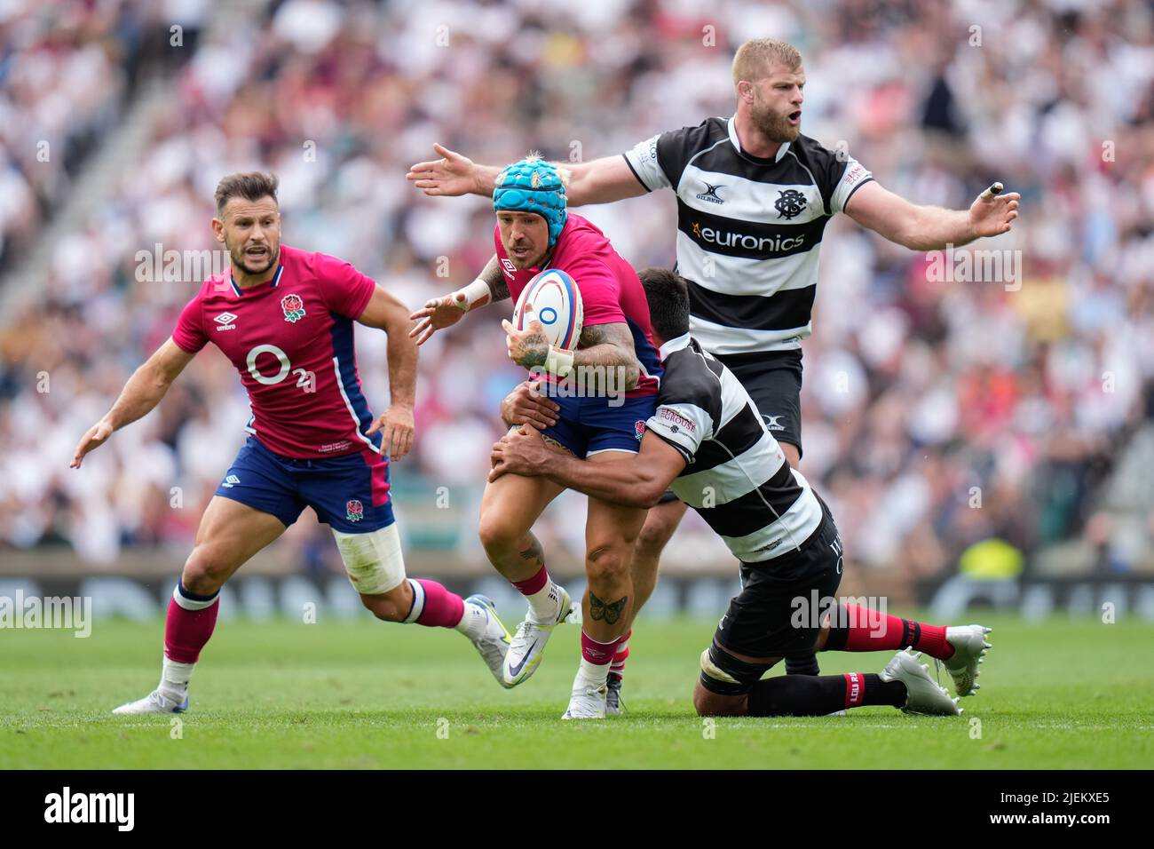 England's Jack Nowell makes a break during the England -V- Barbarians ...