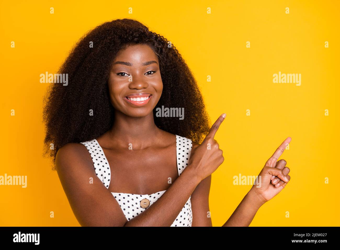Portrait of nice optimistic brunette lady point empty space wear white ...