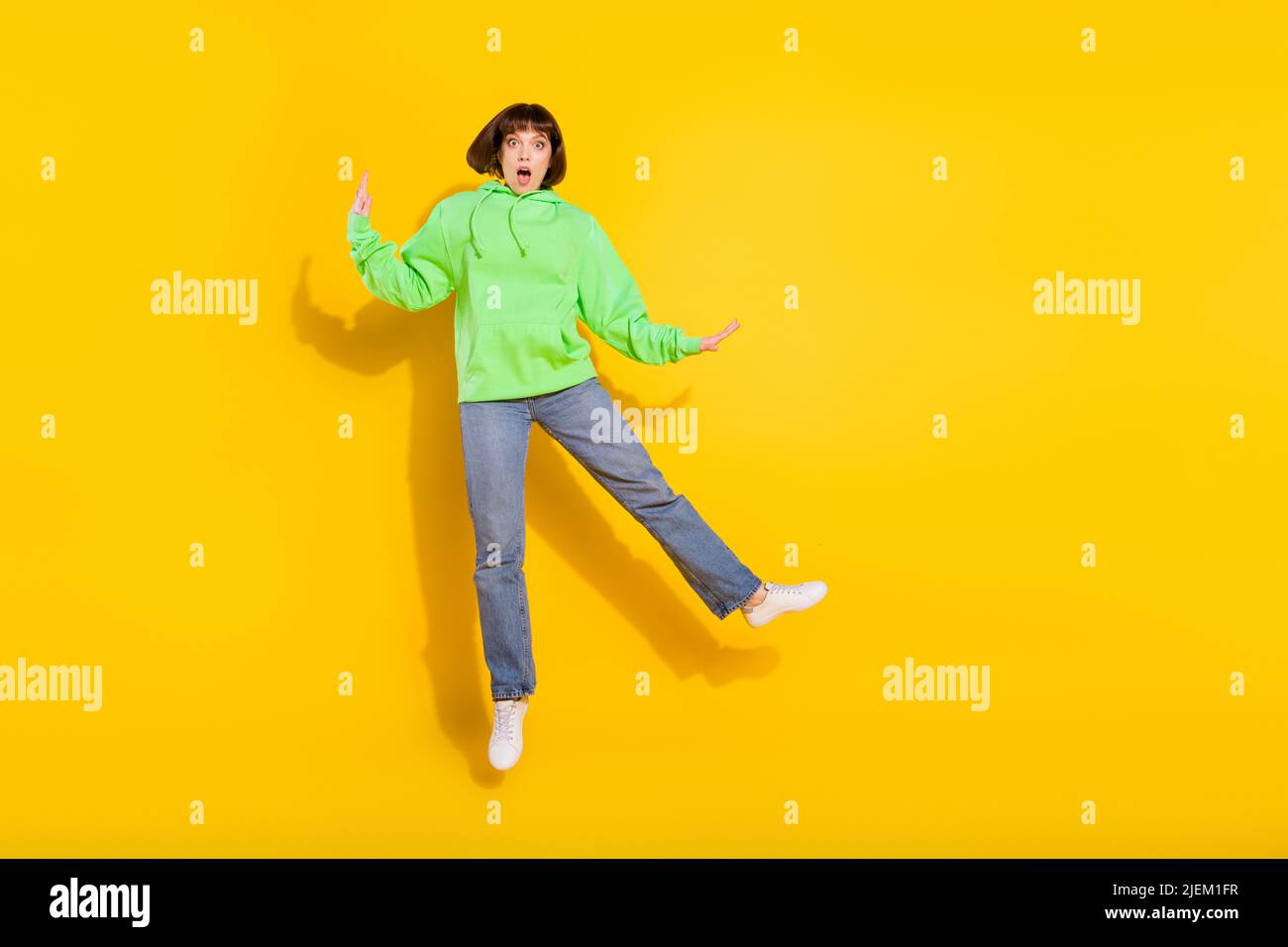 Full length photo of charming young happy lady amazed shocked jump up ...