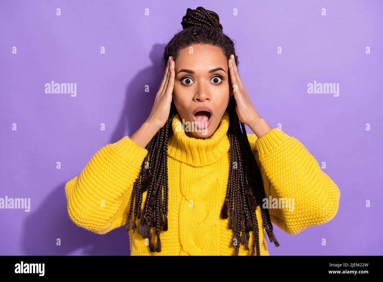 Photo of young african girl amazed shocked fake novelty hands touch ...