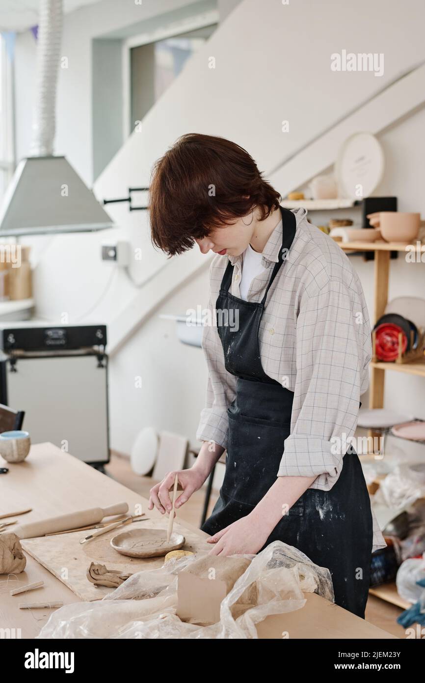 Woman bending over table hi-res stock photography and images - Alamy