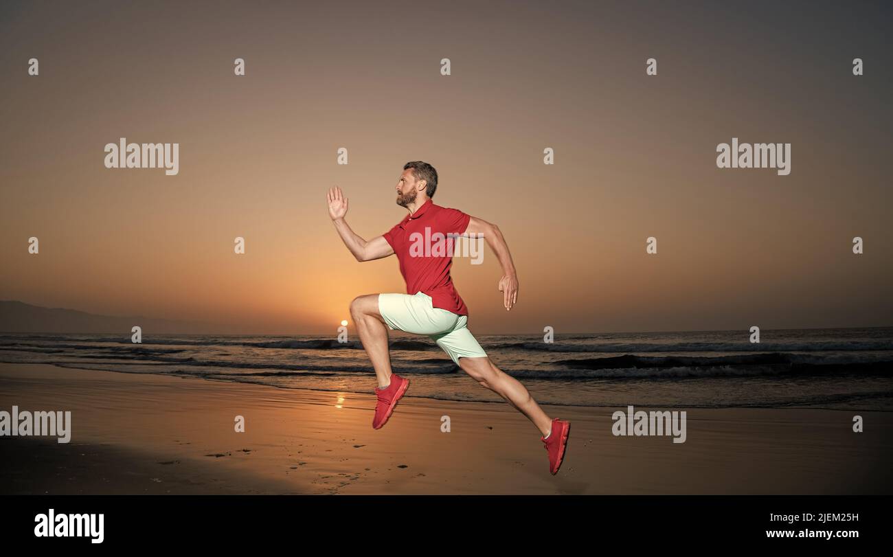 athletic man runner running on sunset summer beach, challenge Stock ...