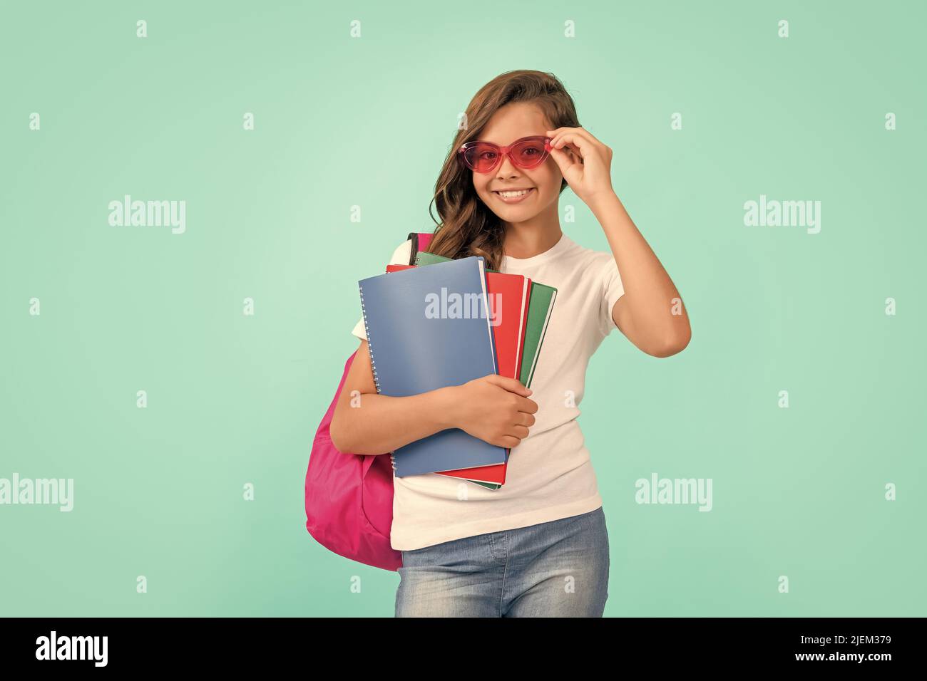 happy schoolgirl carry backpack and notepad. back to school. knowledge ...