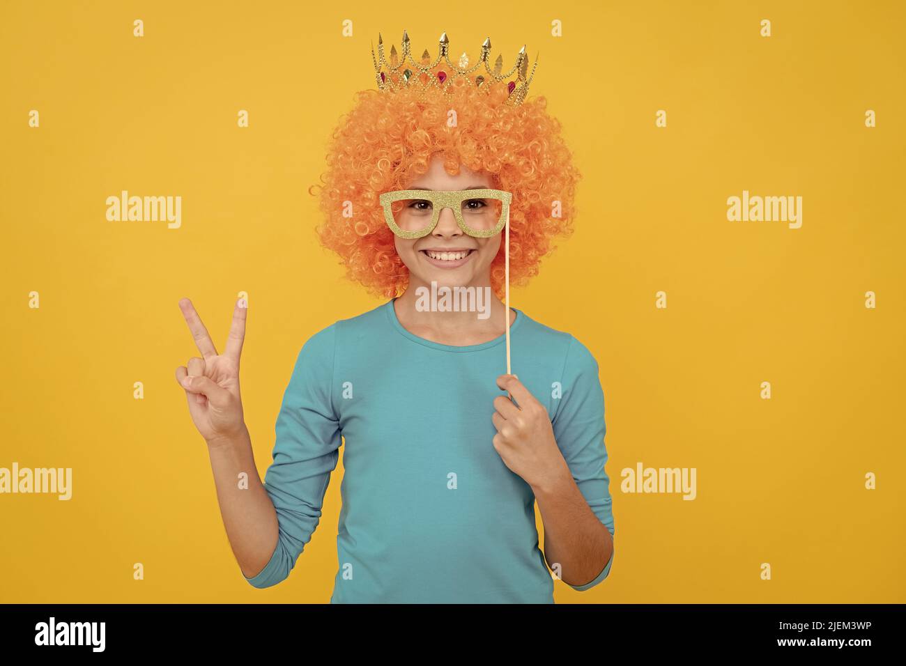 happy teen girl in fancy clown wig wear queen crown and funny party ...