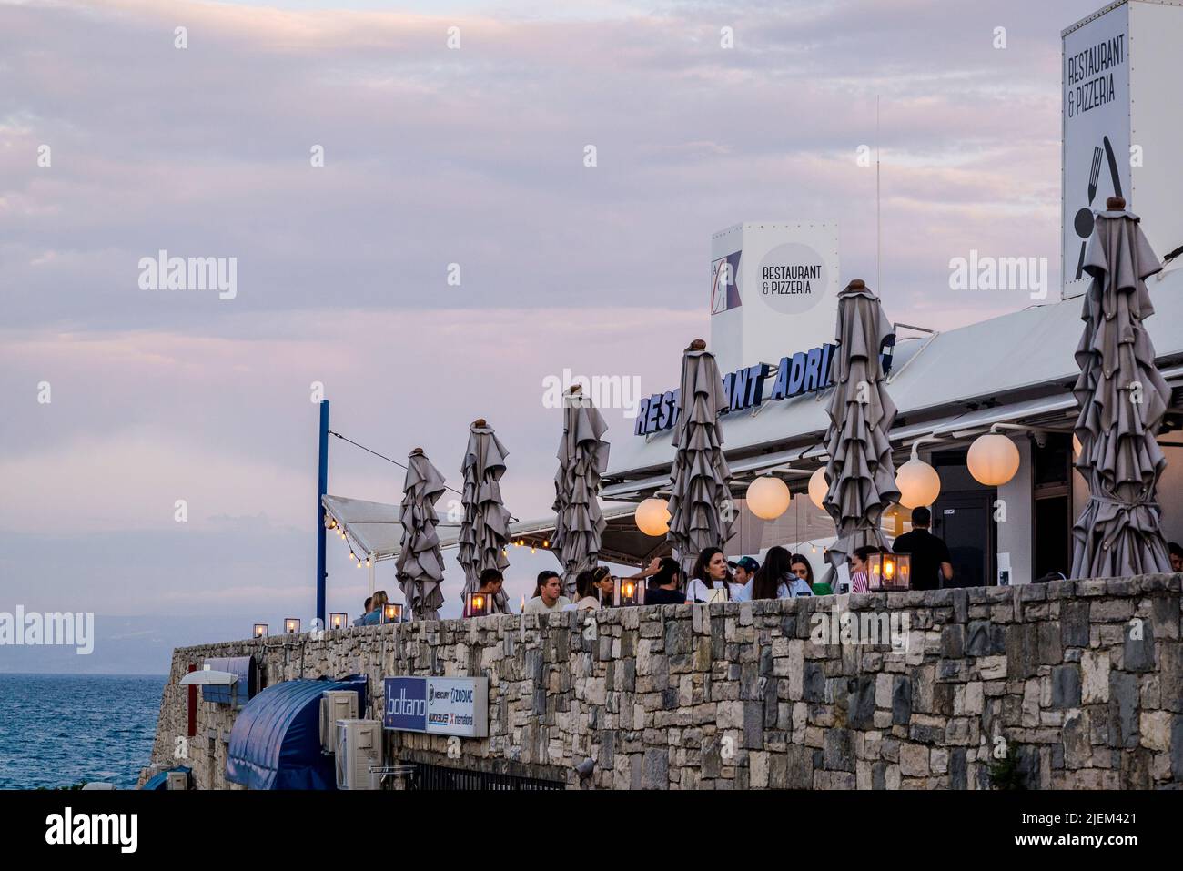 Alfresco dining next to the sea in a restaurant at Sustipan, Split ...