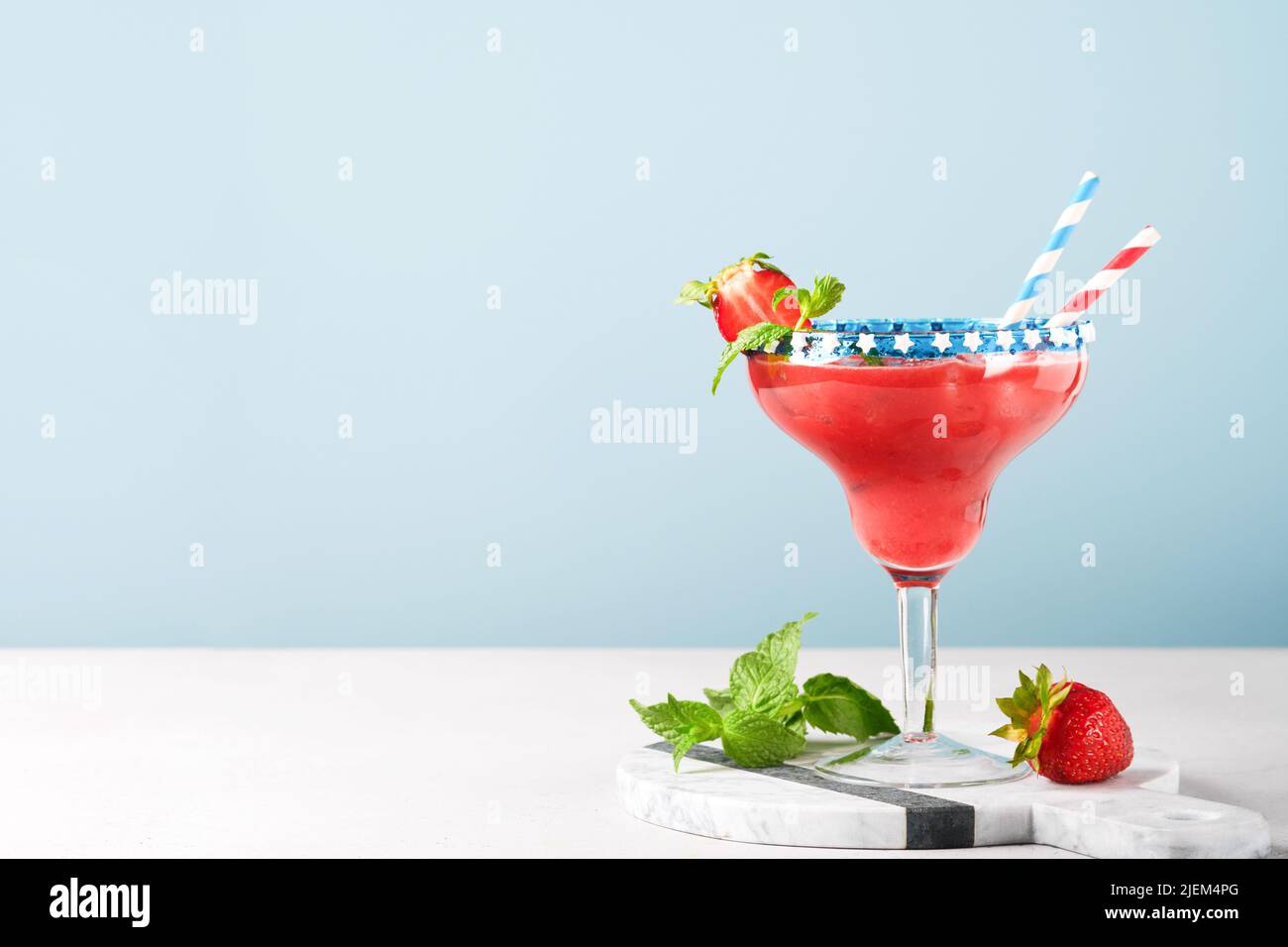 Patriotic Cocktail 4th july. Glass margarita cocktail with strawberry ...