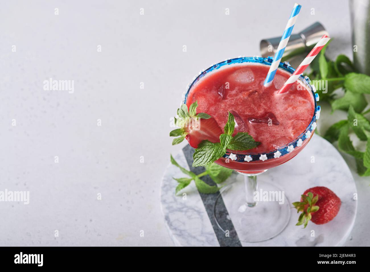 Patriotic Cocktail 4th july. Glass margarita cocktail with strawberry ...