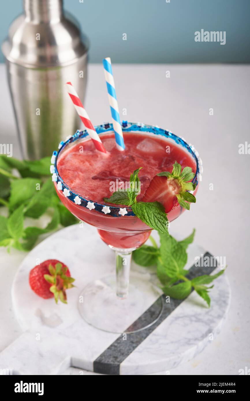Patriotic Cocktail 4th july. Glass margarita cocktail with strawberry ...