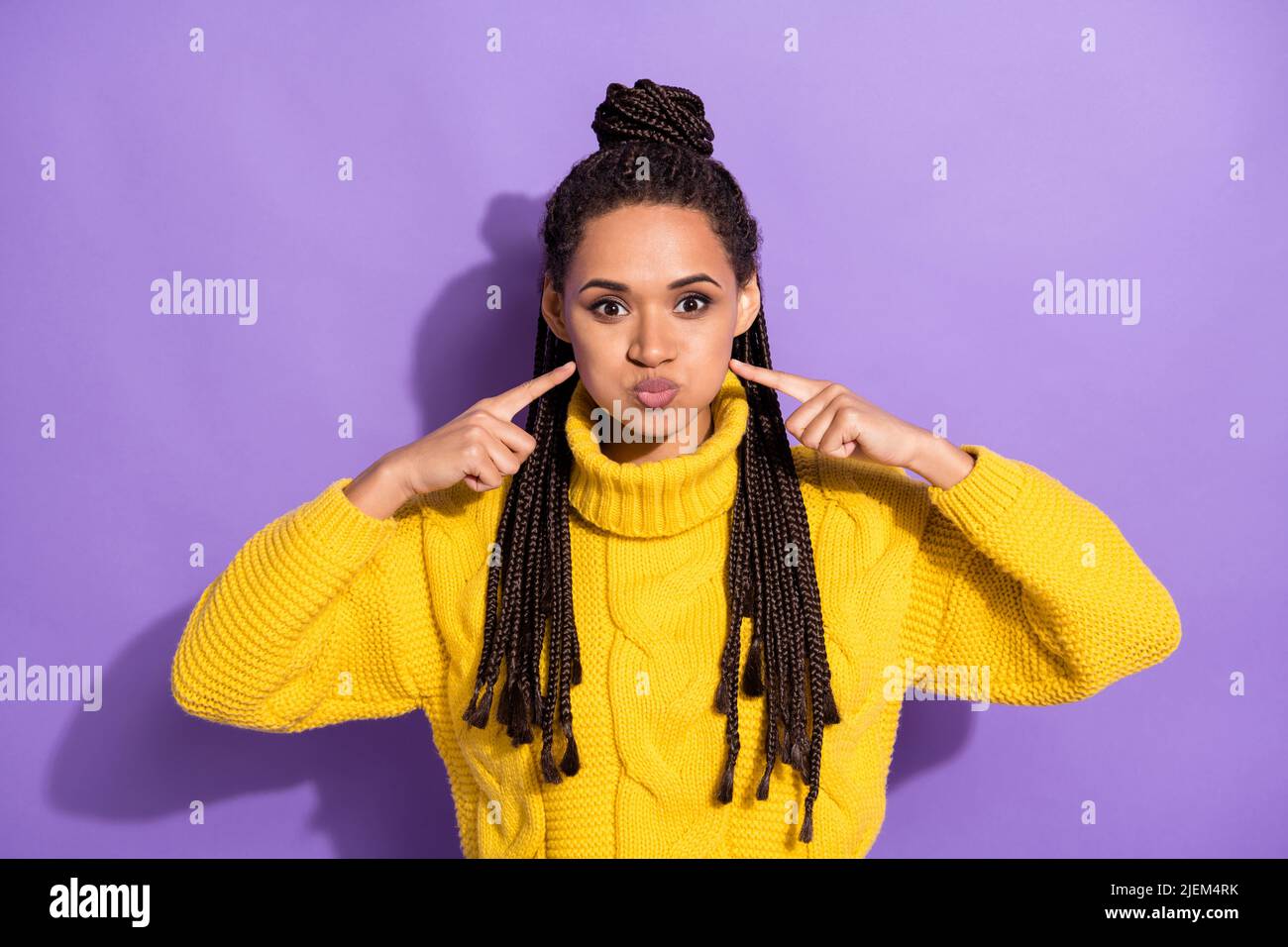 Photo portrait of funny girl with puff cheeks pointing fingers isolated ...