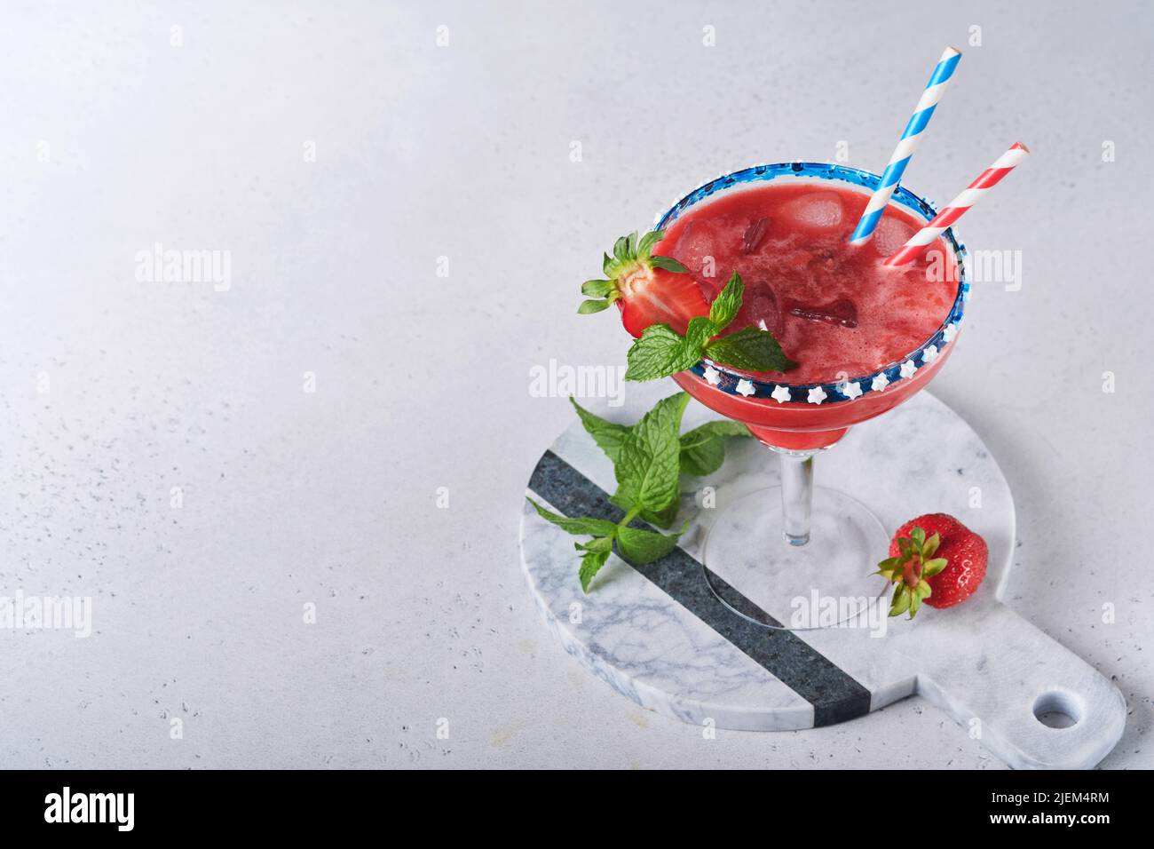 Patriotic Cocktail 4th july. Glass margarita cocktail with strawberry ...