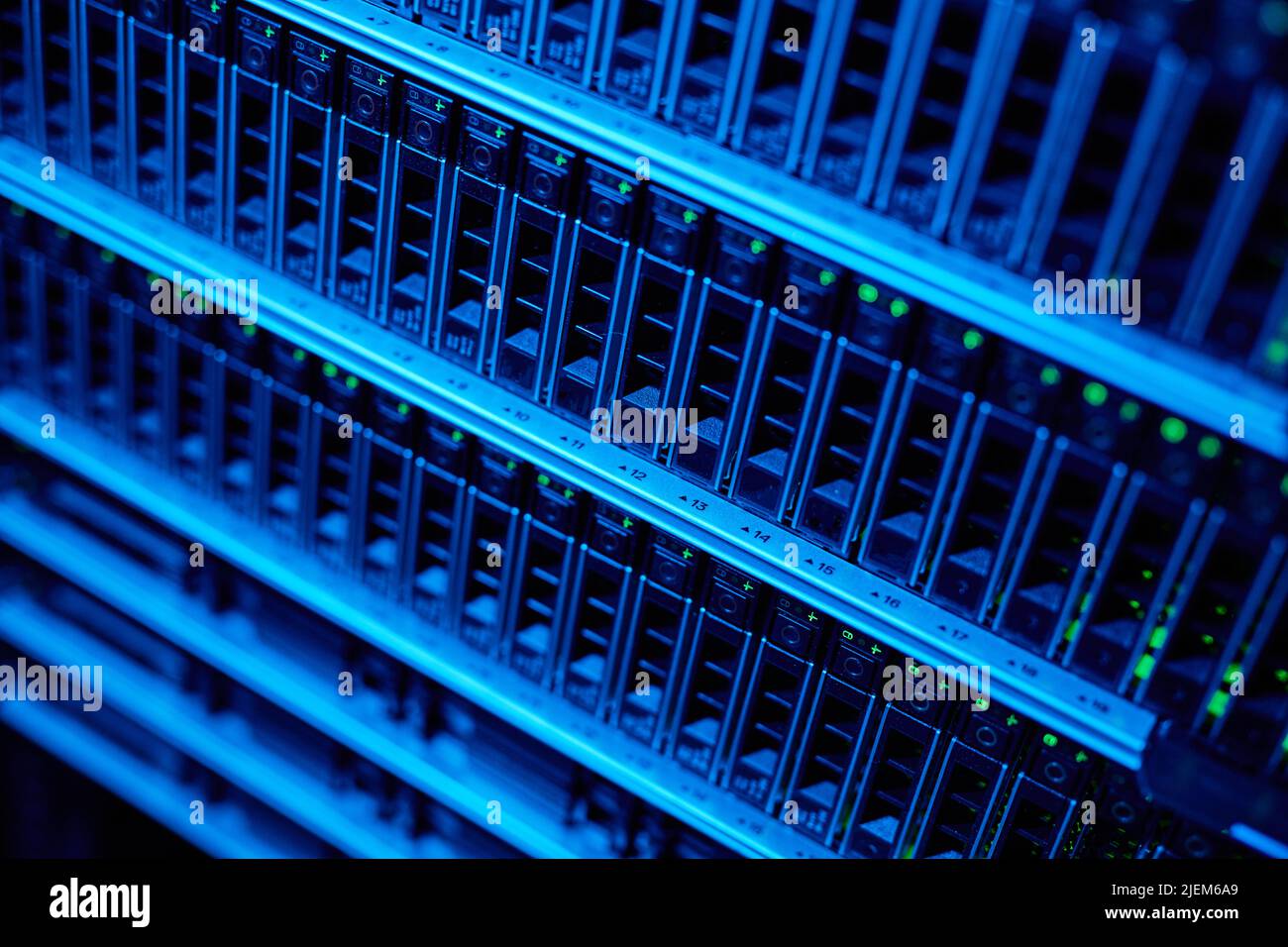 Background image of blade servers in blue neon light stacked in data ...