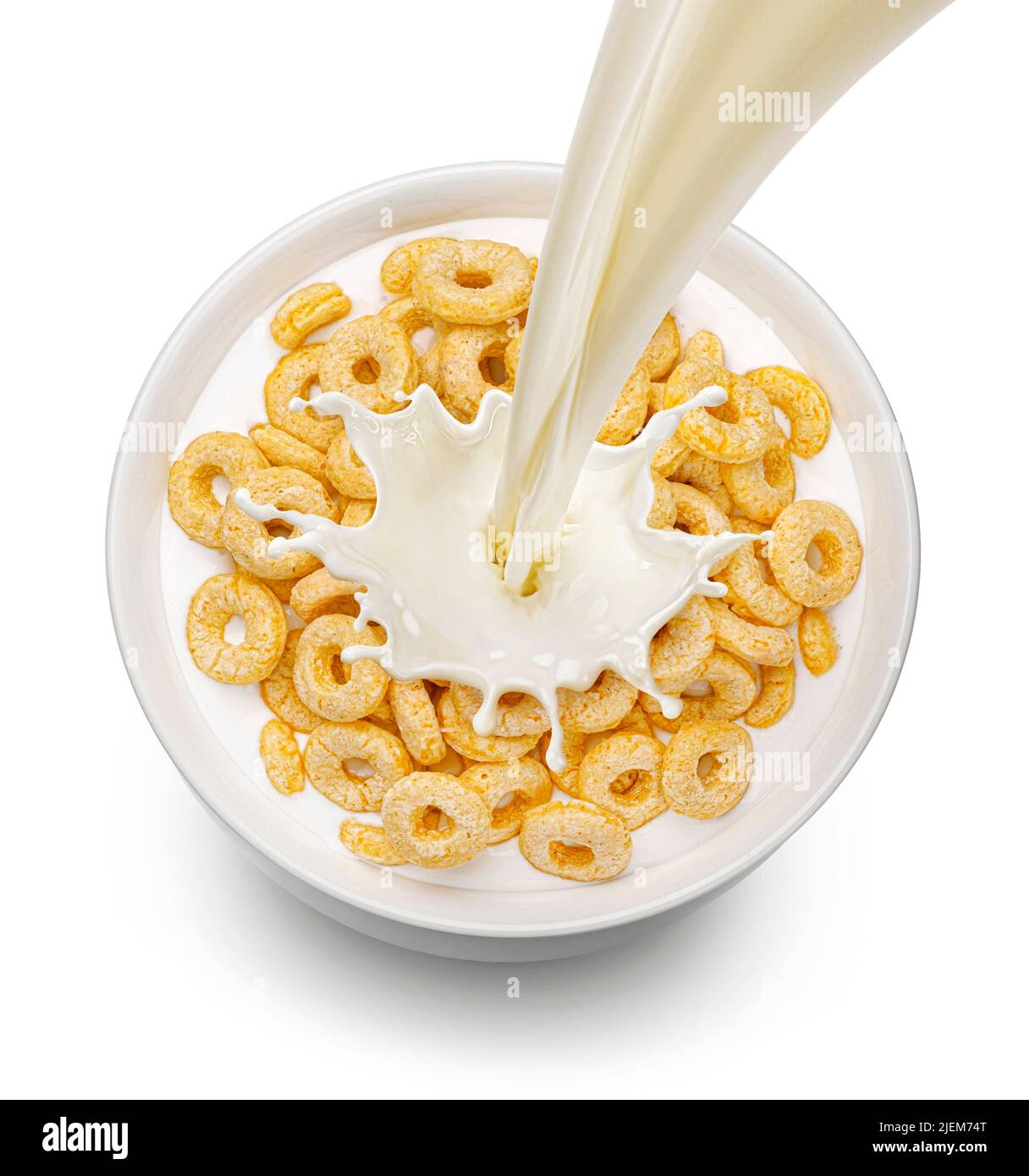 Corn rings with pouring milk isolated on white background, top view ...