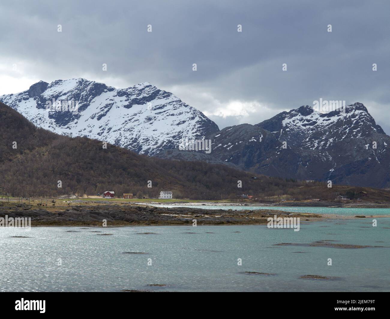 Landscape view of mountain snow and a lake fjord in polar and arctic ...