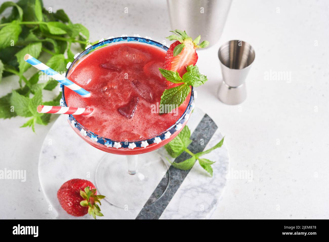 Patriotic Cocktail 4th july. Glass margarita cocktail with strawberry ...