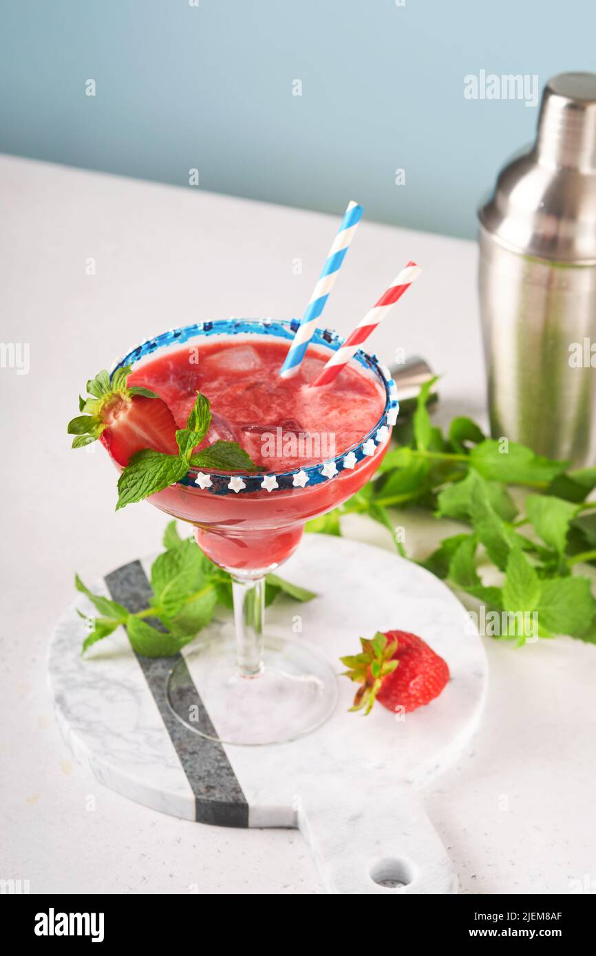 Patriotic Cocktail 4th july. Glass margarita cocktail with strawberry ...
