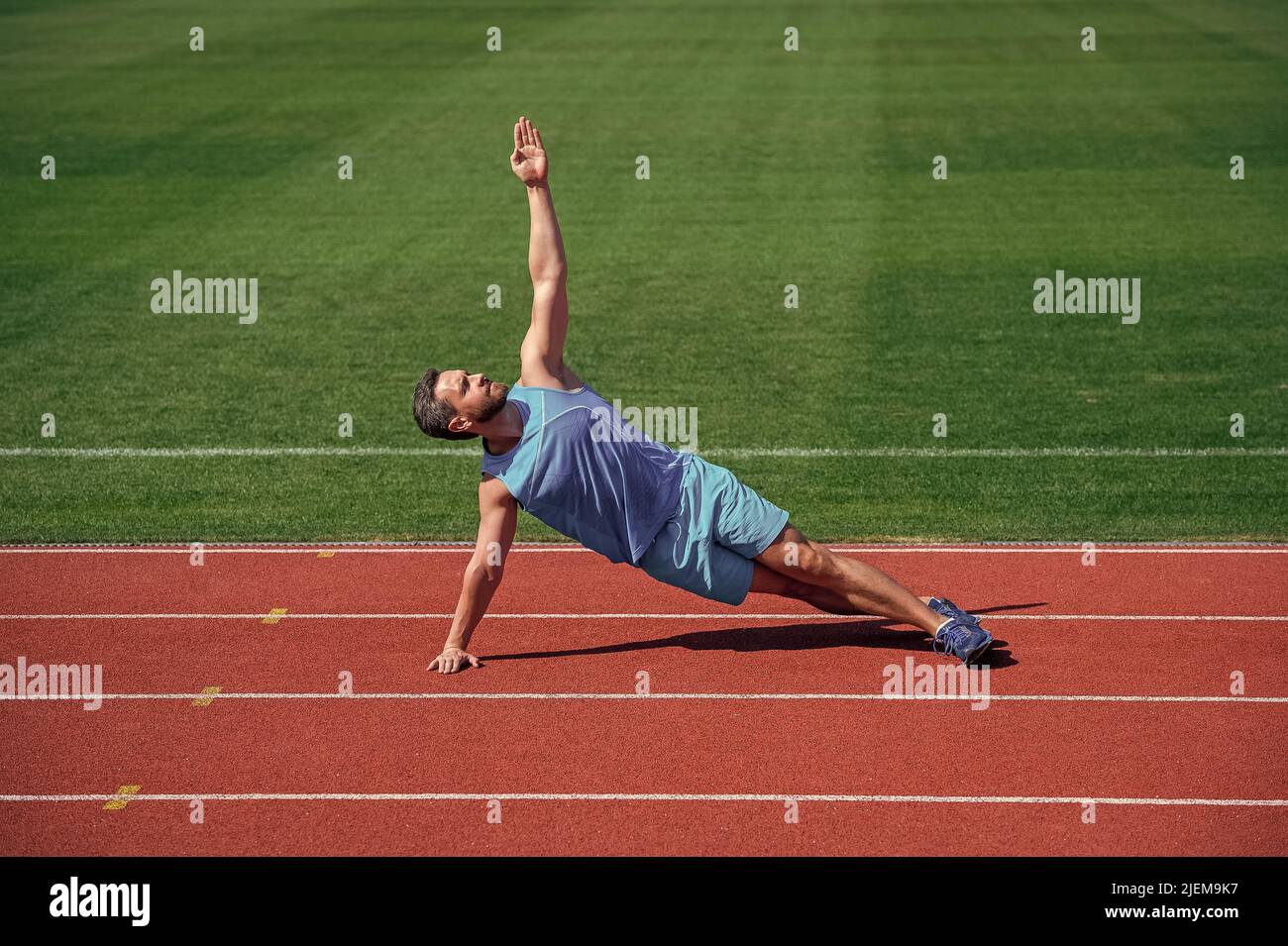 athletic muscular man warming up before training, yoga Stock Photo - Alamy