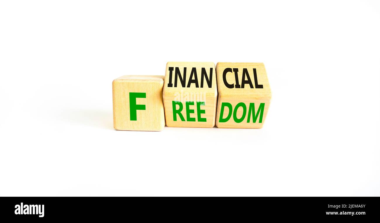 Financial freedom symbol. Concept words Financial freedom on wooden ...