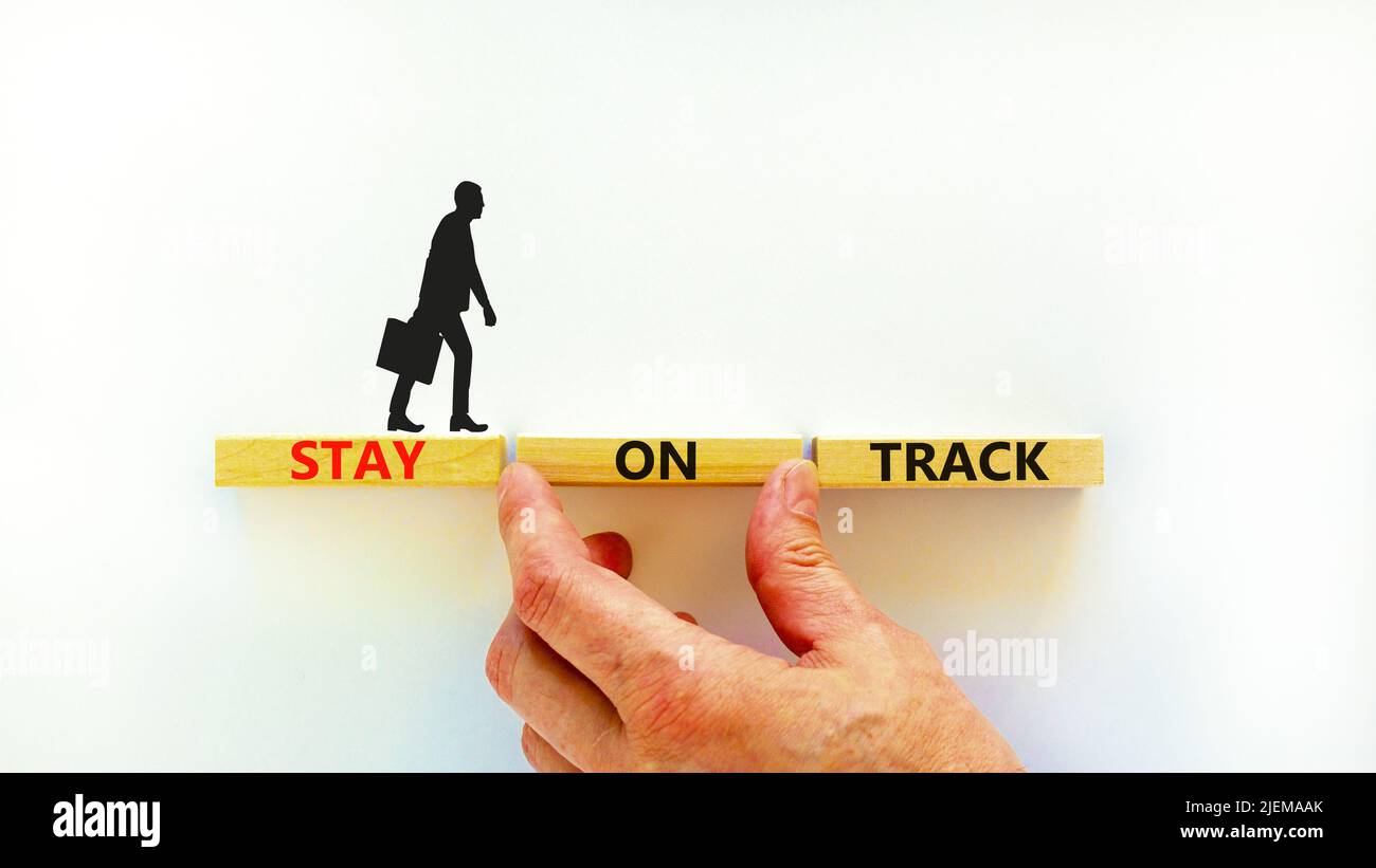 Stay on track symbol. Concept words Stay on track on wooden blocks on a ...