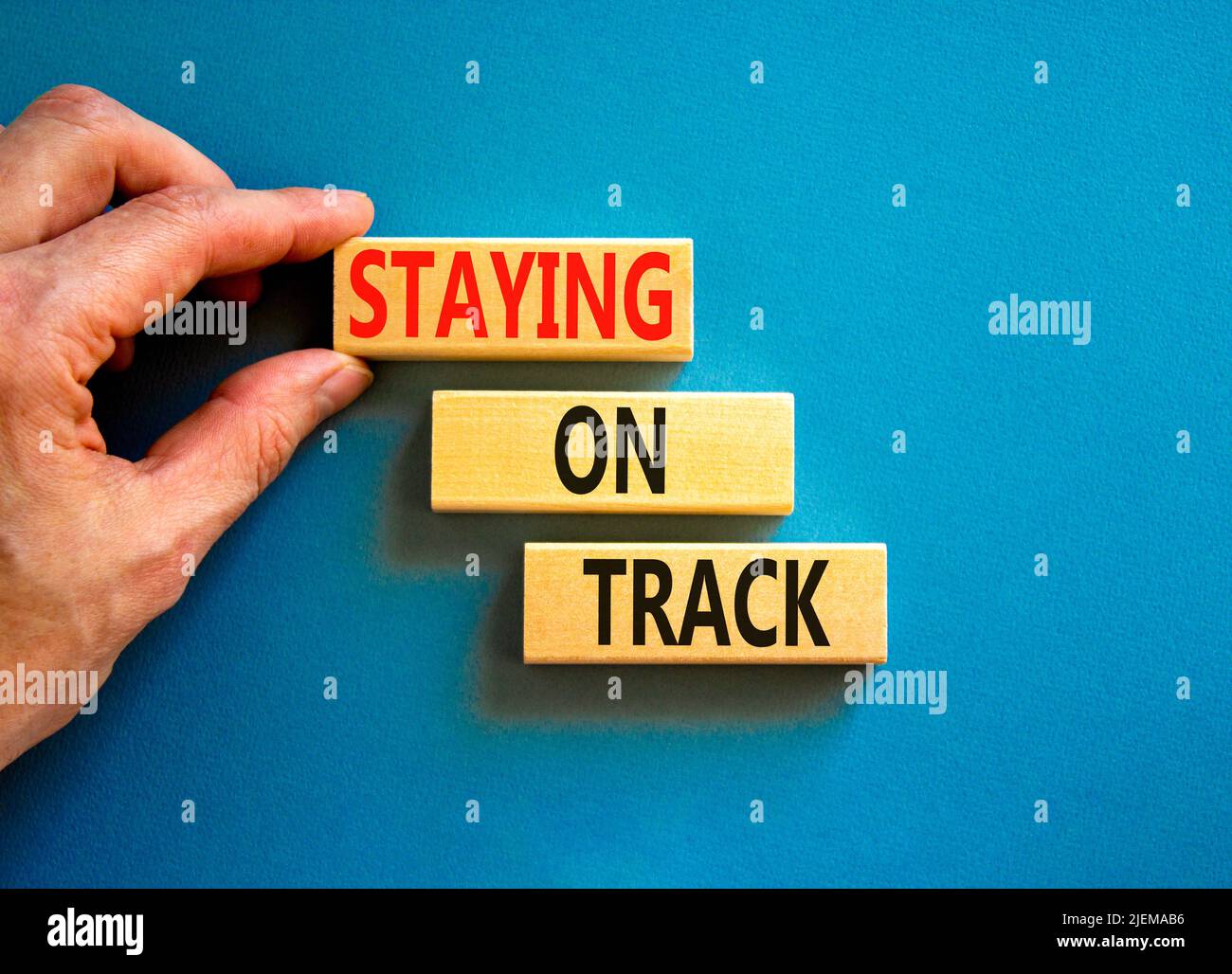 Staying on track symbol. Concept words Staying on track on wooden ...